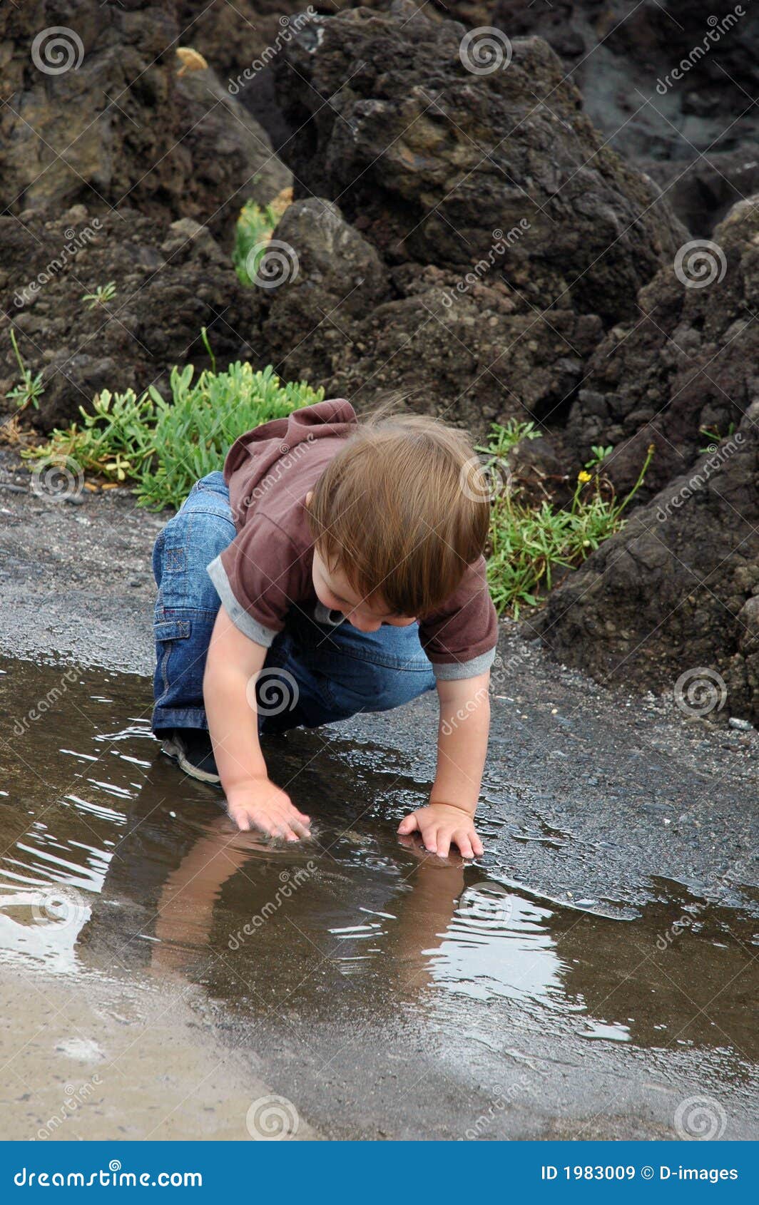 Puddle Play 2 stock image. Image of rocks, people, cute - 1983009
