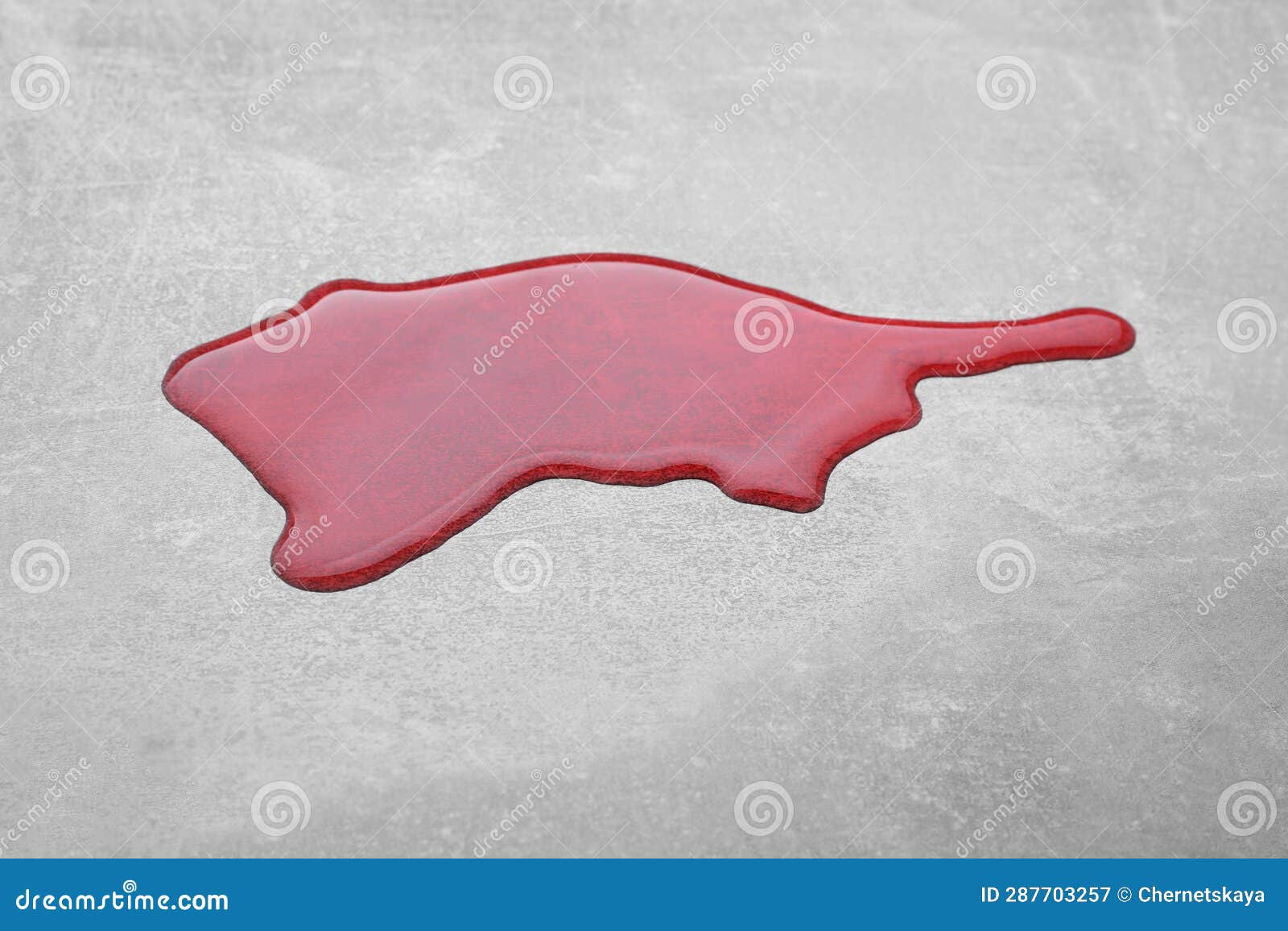 Puddle of Red Liquid on Light Grey Surface Stock Image - Image of ...
