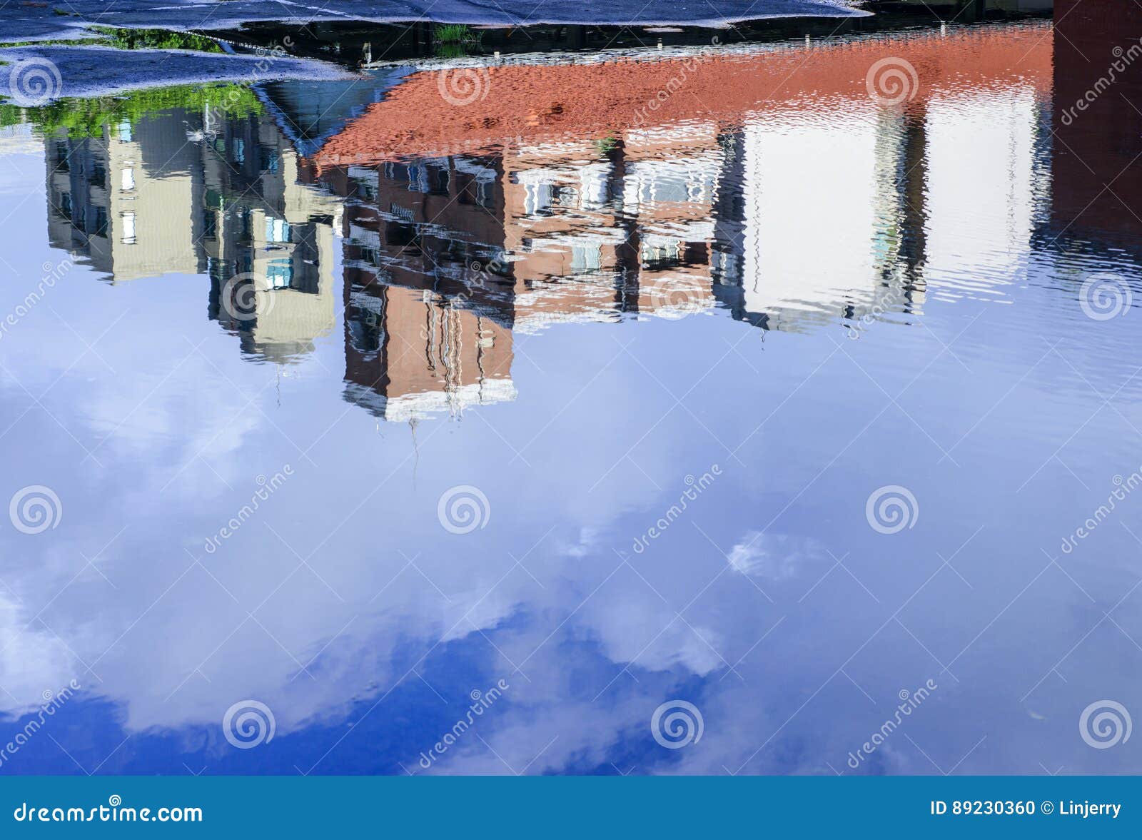 Puddle reflection of house stock photo. Image of piazza - 89230360