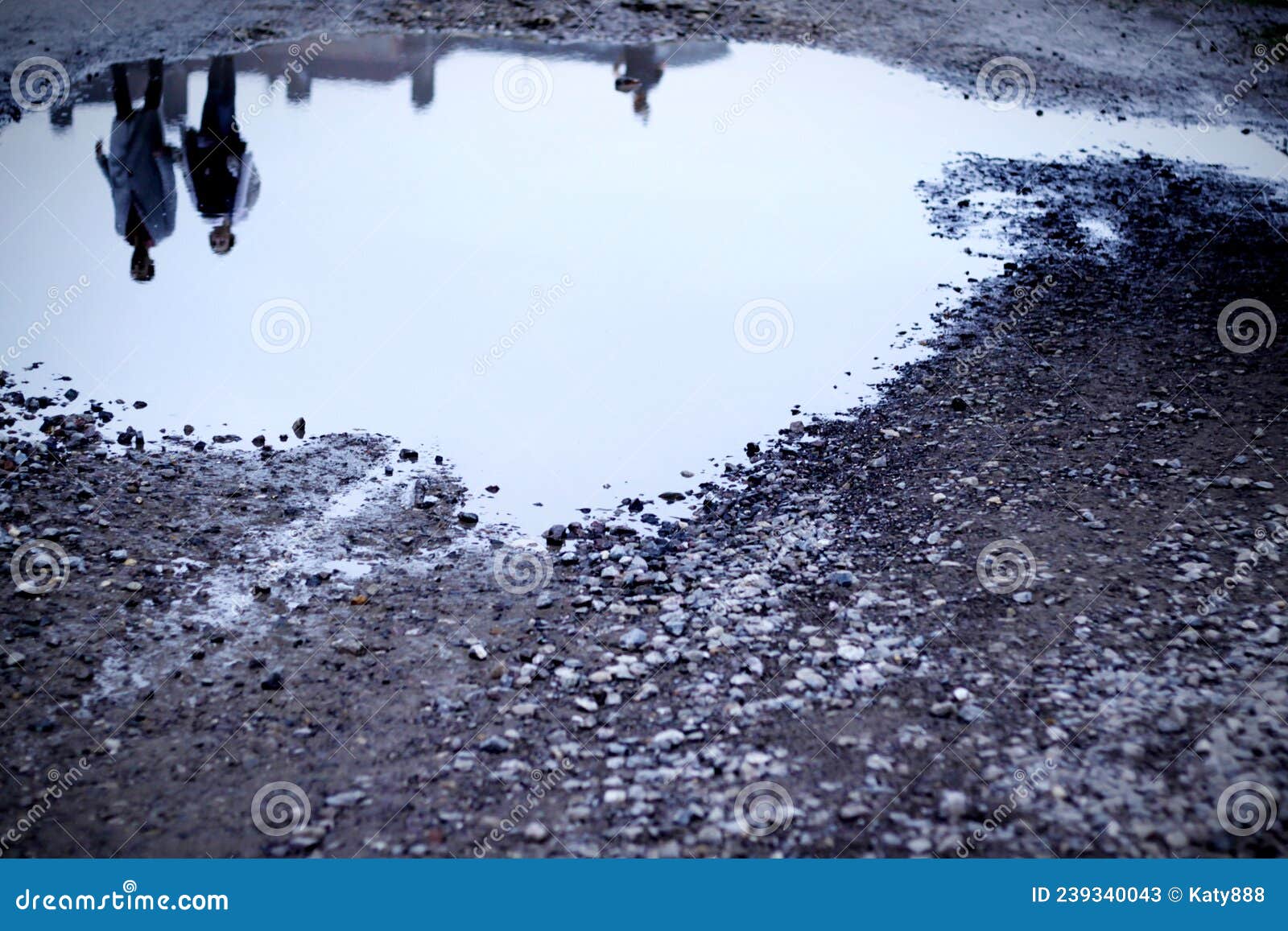 Puddle Reflection with Walking Persons, High Contrast Stock Image ...