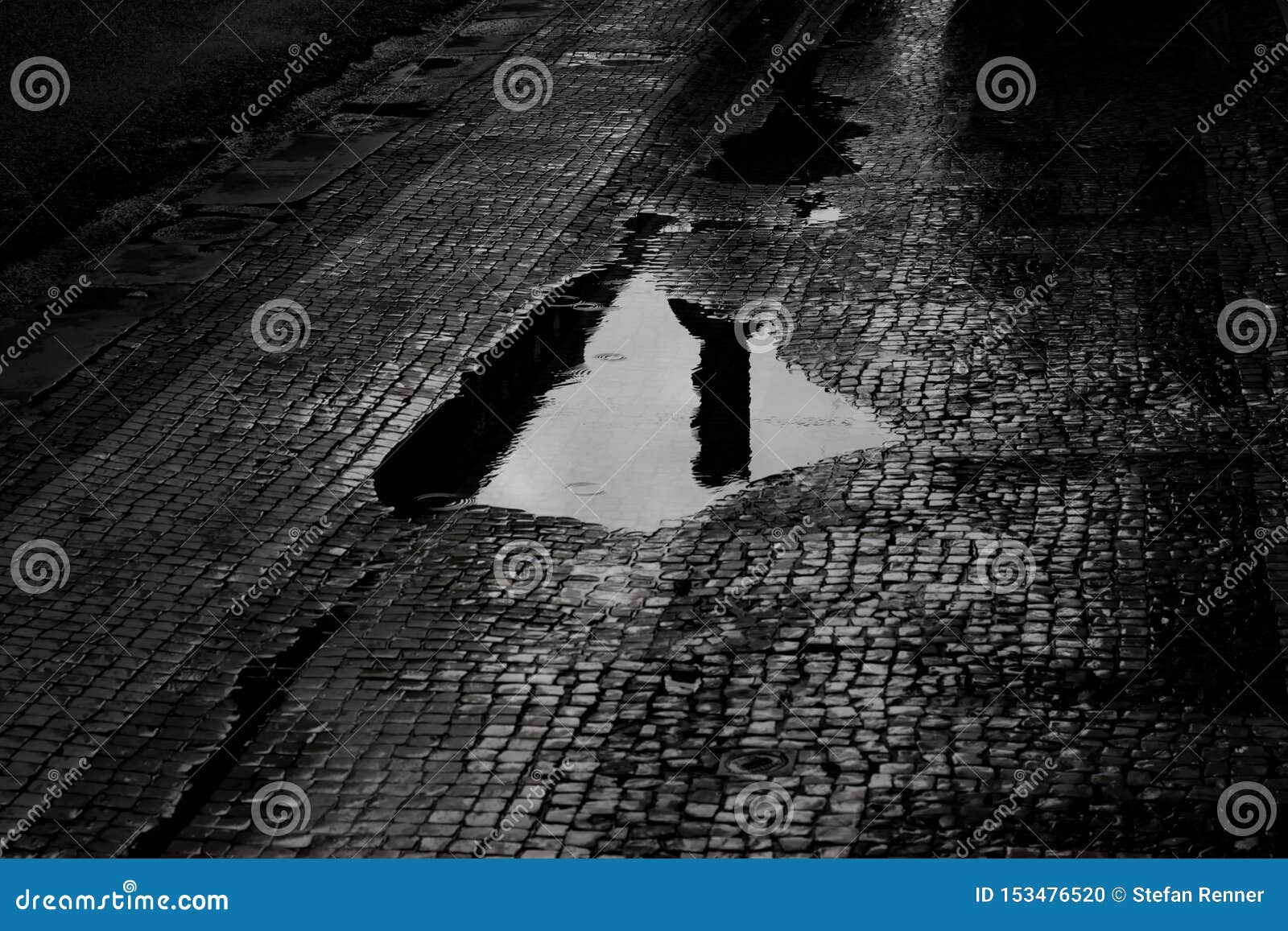 Puddle reflection stock photo. Image of bright, cobblestones - 153476520
