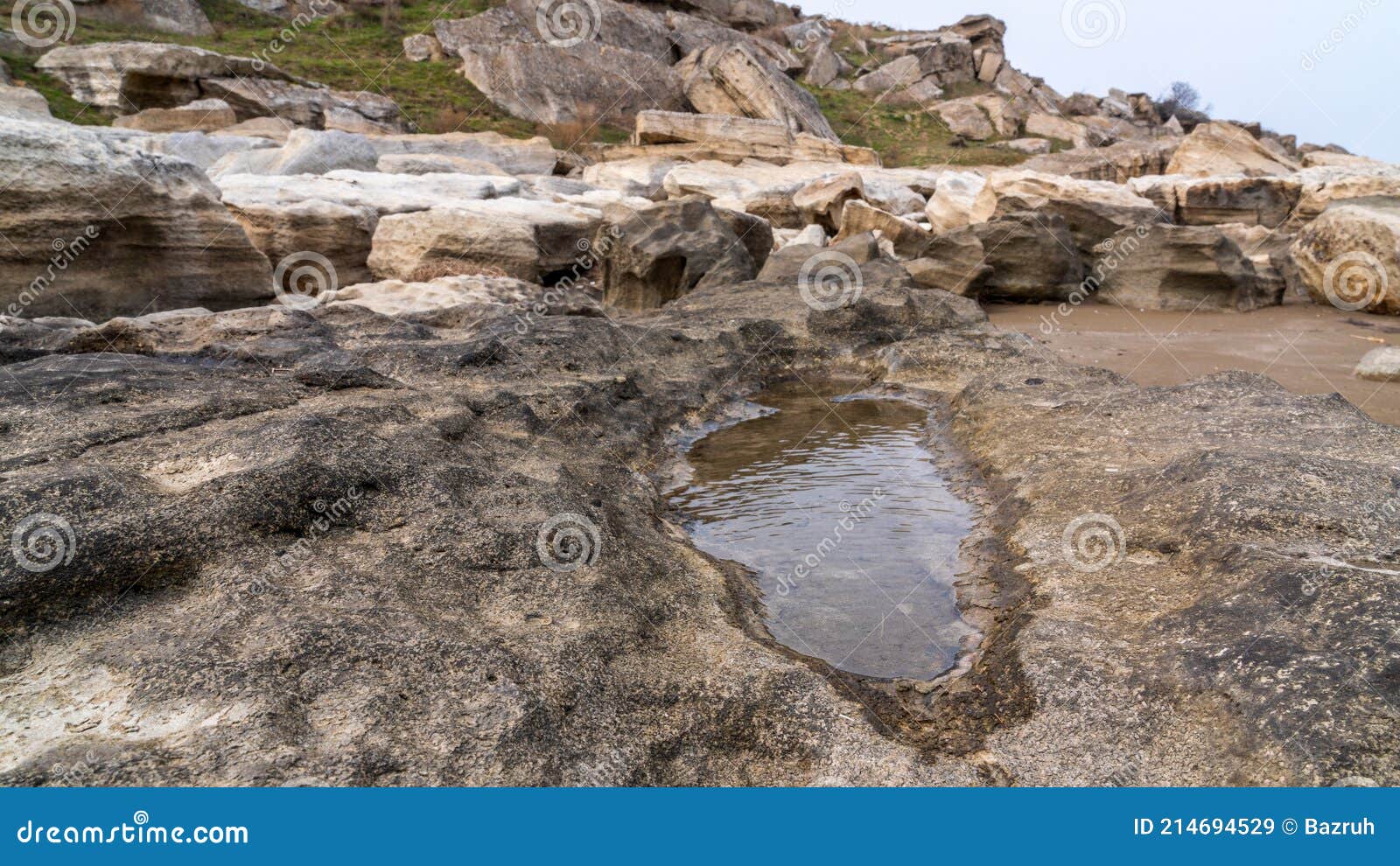 Puddle in the rock stock image. Image of reflection - 214694529