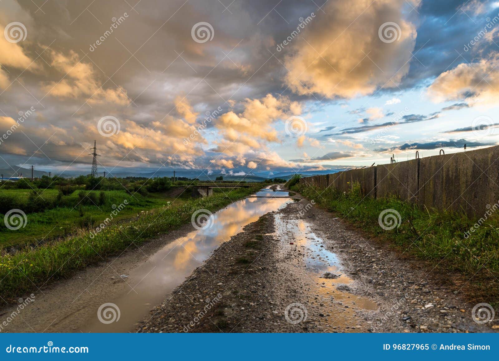 Puddle in sunset colors stock image. Image of morass - 96827965