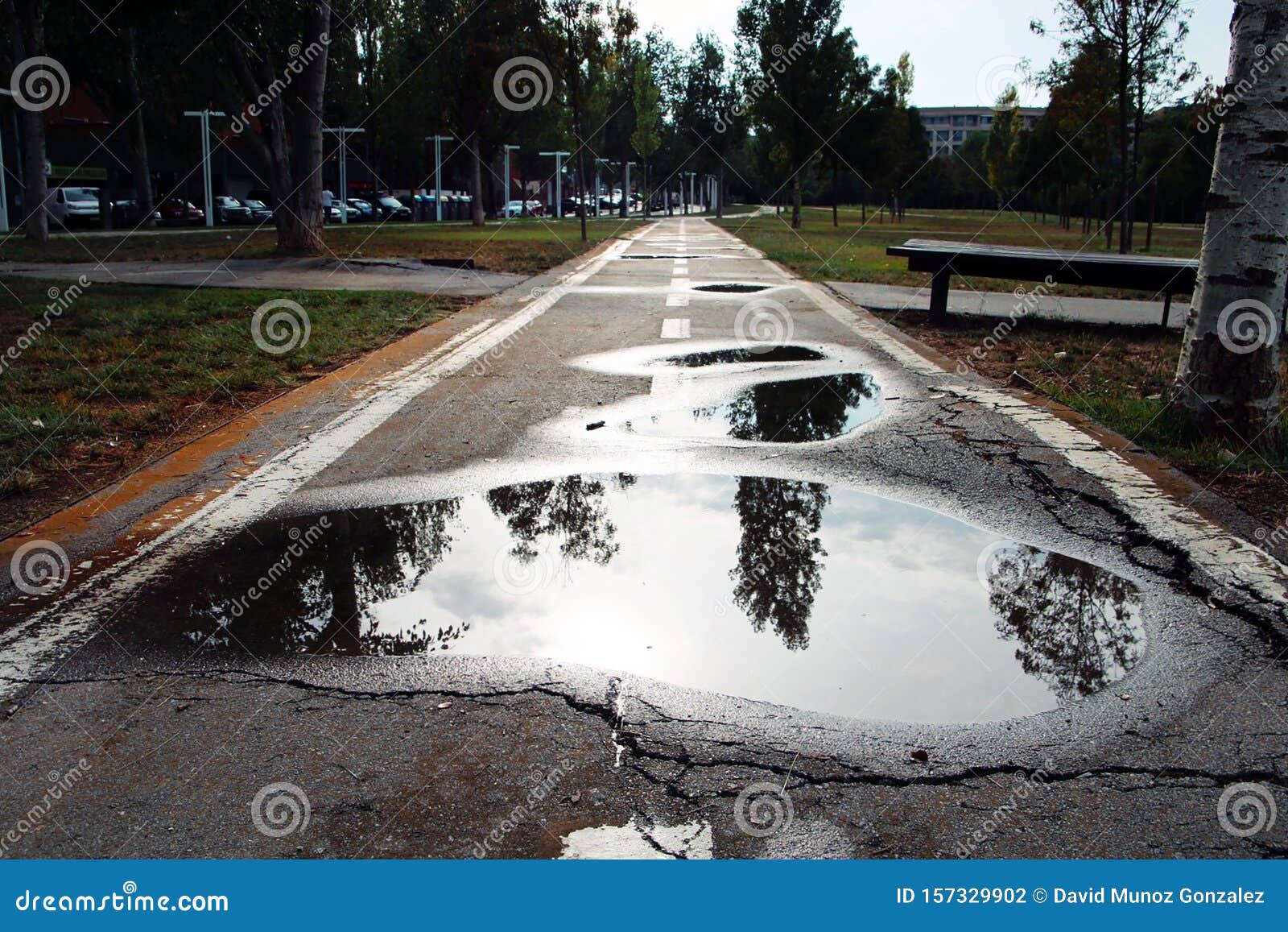 Puddle of Water on Asphalt and Old Road Stock Photo - Image of puddle ...