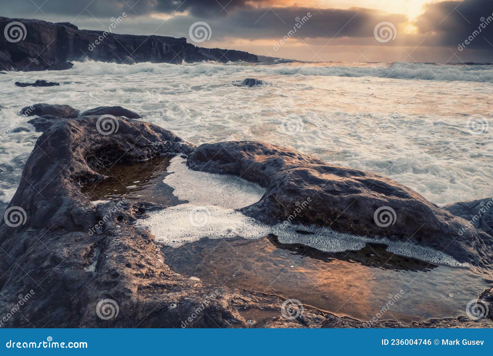 Puddle of Water with Foam on a Rough Stone by the Ocean. Dramatic Ocean ...