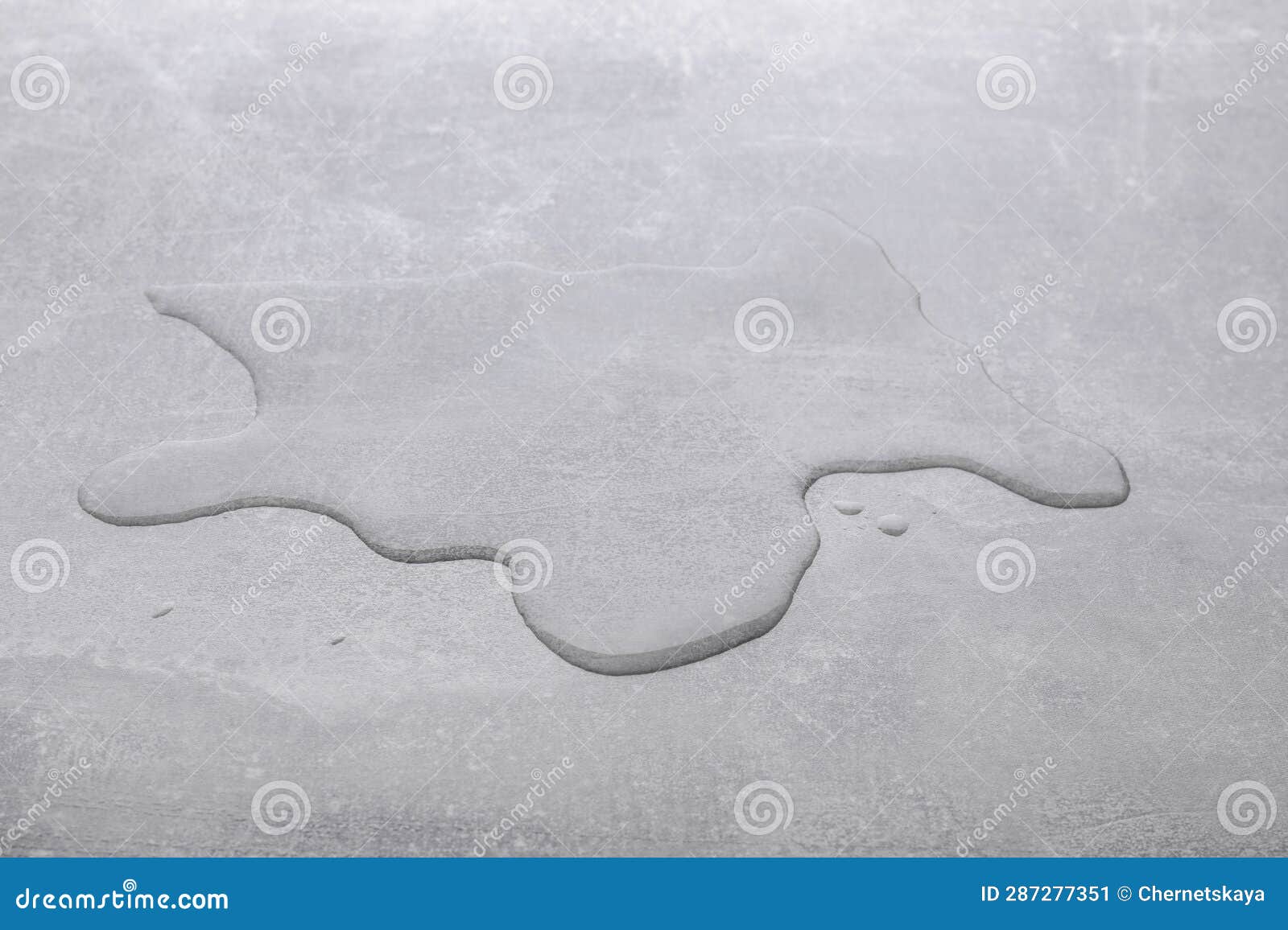 Puddle of Water on Light Grey Surface Stock Image - Image of liquid ...