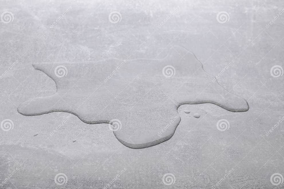 Puddle of Water on Light Grey Surface Stock Image - Image of liquid ...