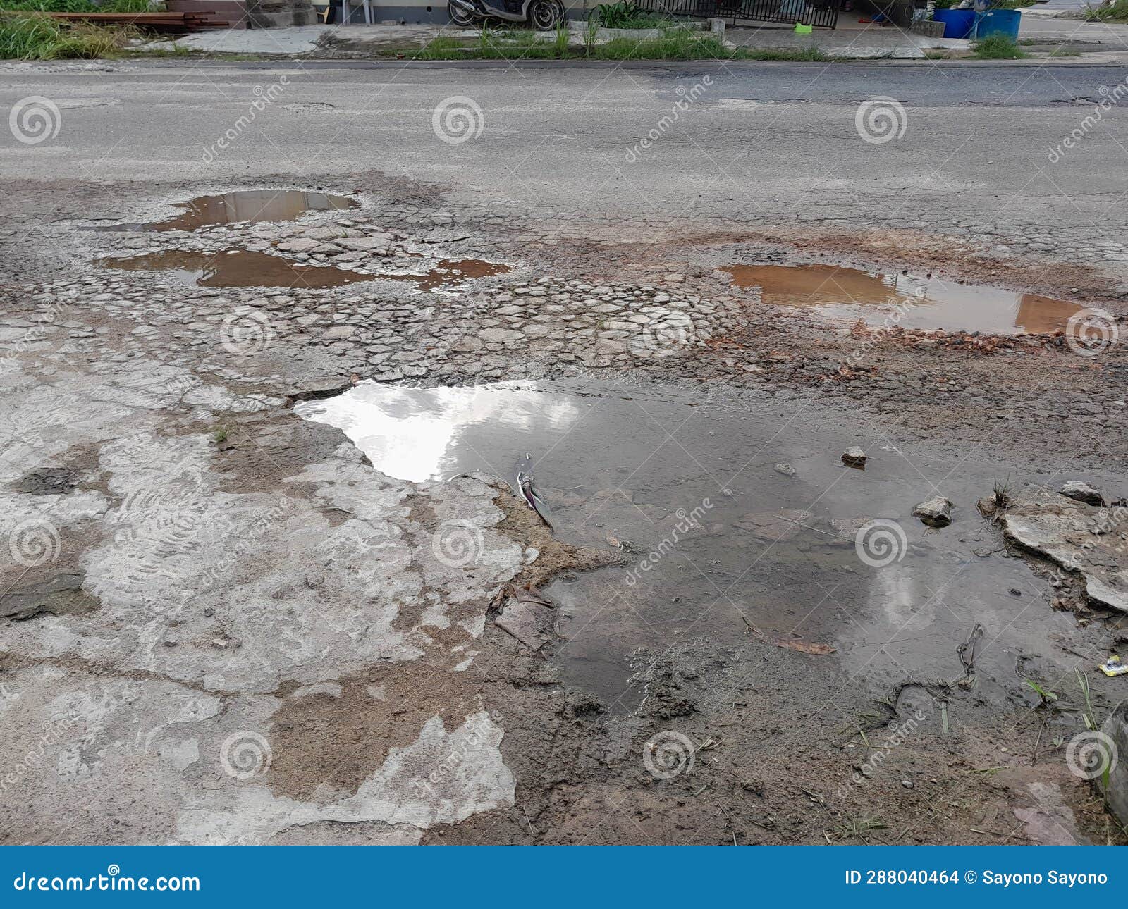 Puddle of Water in the Middle of the Asphalt Road. Stock Photo - Image ...