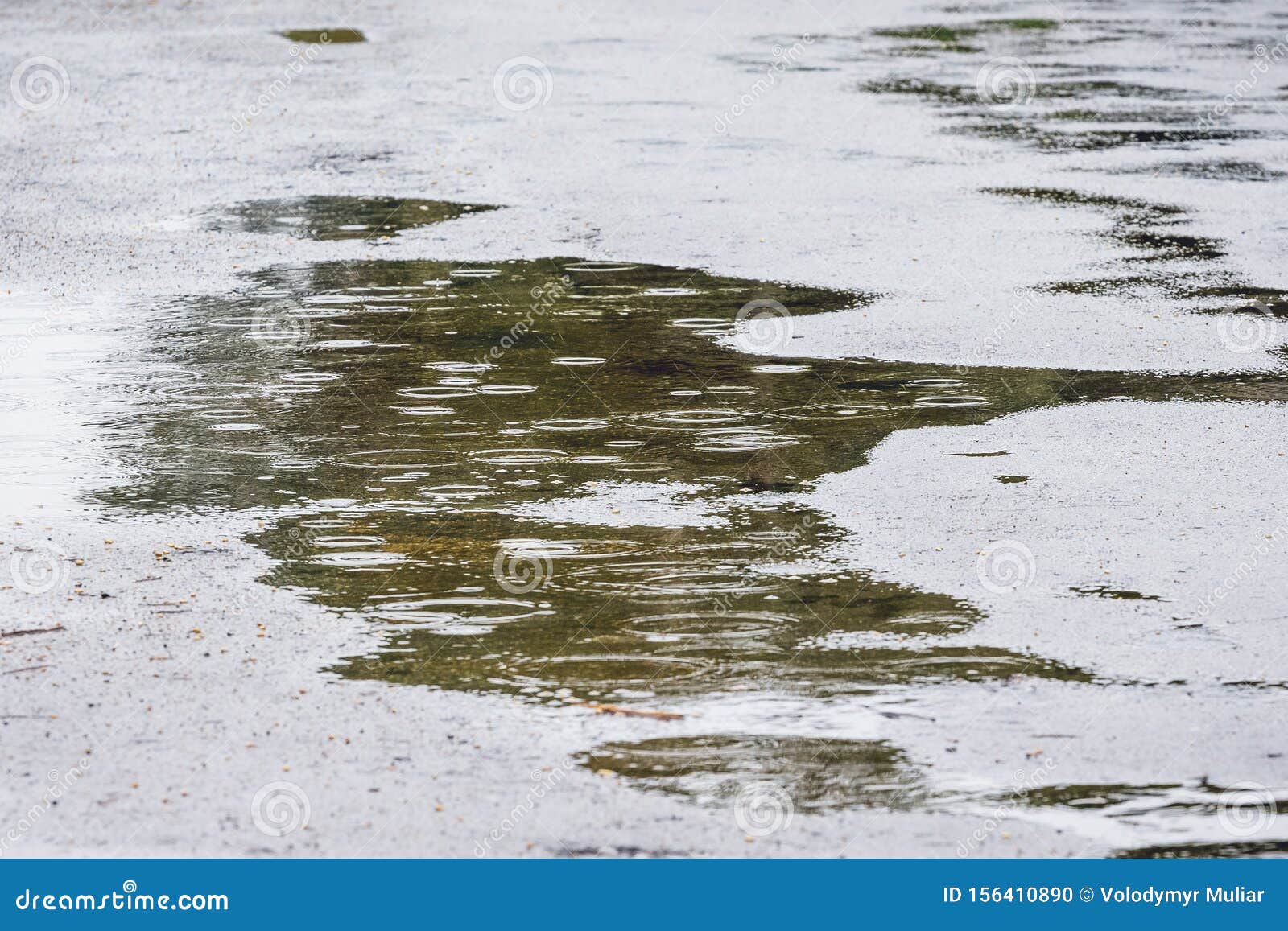 A Puddle of Water with Ripples from the Rain. it`s Raining_ Stock Photo ...