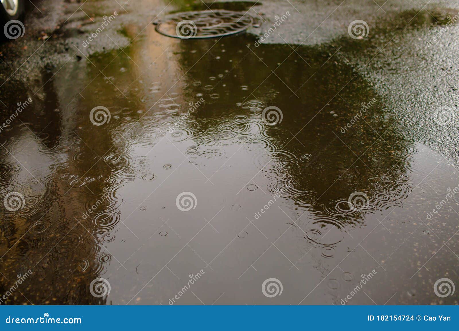 Puddles with Bubbles on the Pavement. Stock Photo - Image of white ...