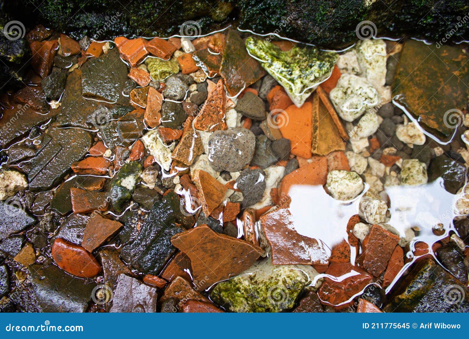 Puddles Filled with Rocks and Tile Shards Stock Image - Image of ...