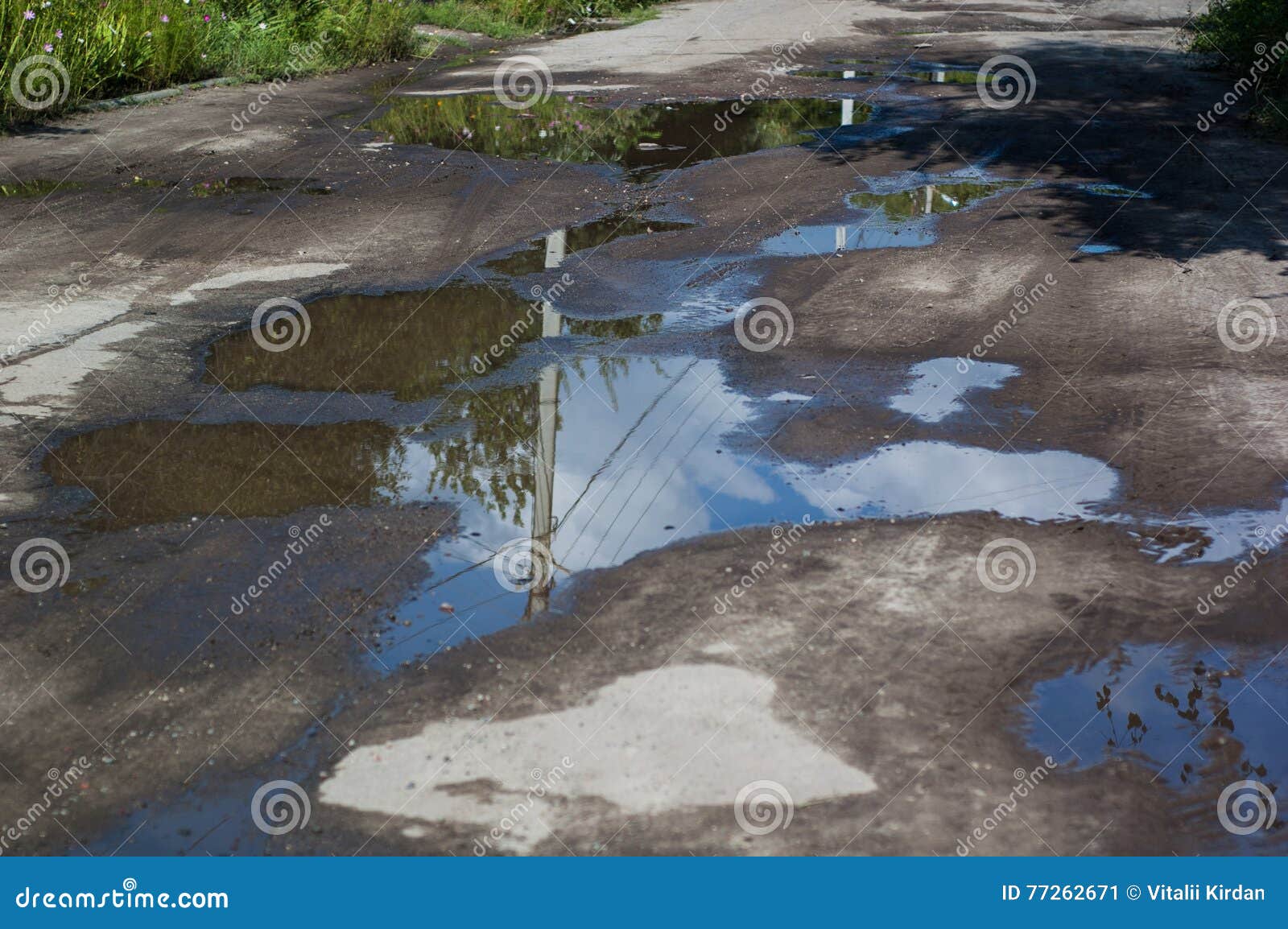 Puddles on the pavement stock image. Image of background - 77262671