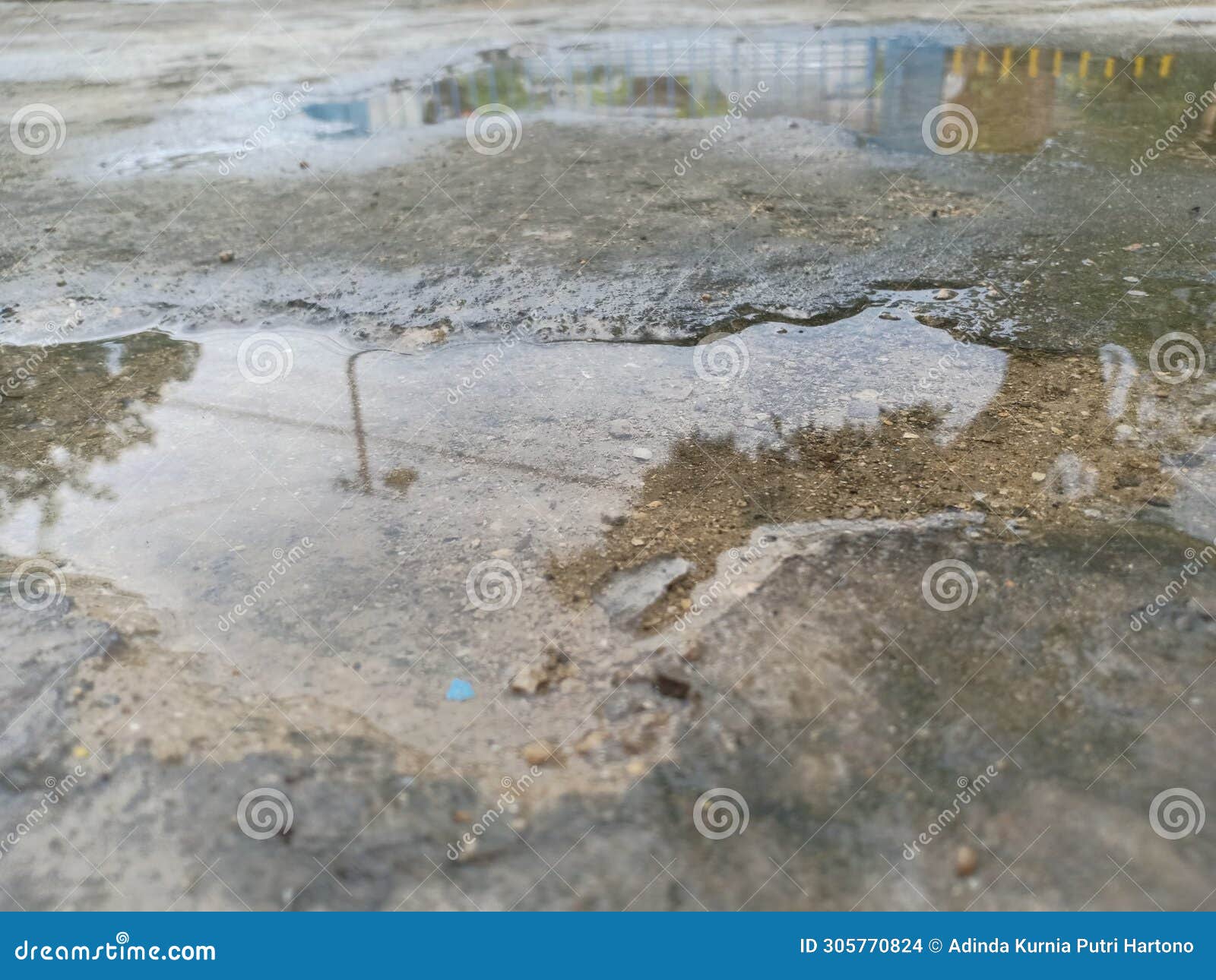 Puddles on Potholed Roads stock photo. Image of puddles - 305770824