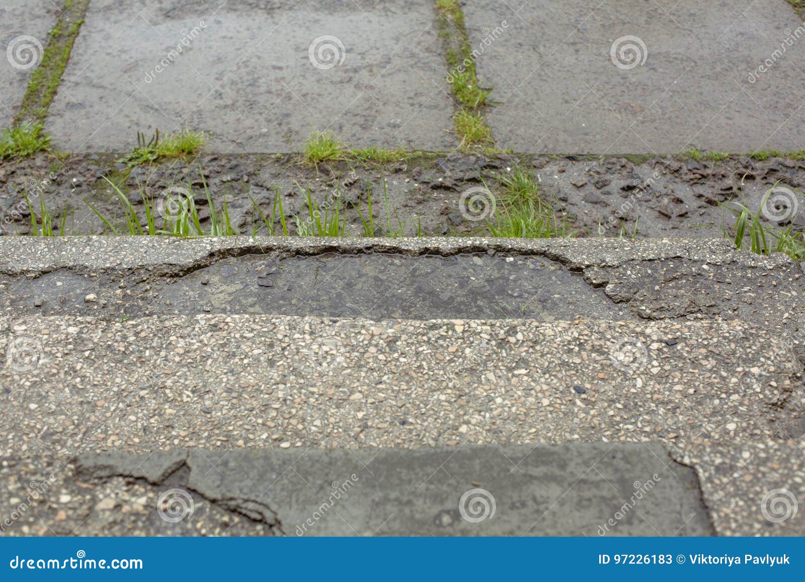 Puddles of Water on the Street with Concrete Slabs Stock Image - Image ...