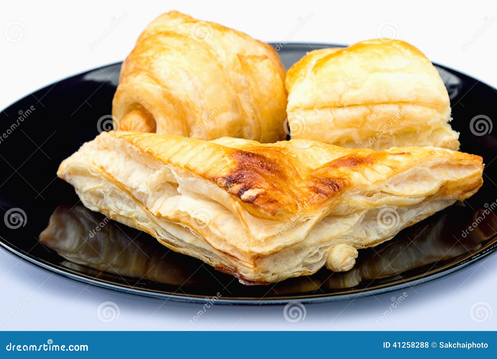 Puff on a Black Plate on Isolate White Background Stock Photo - Image ...