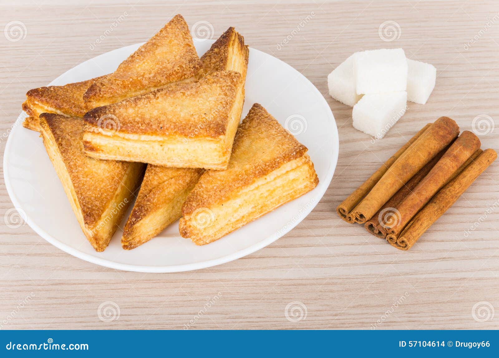 Puff Pastries in Plate, Pieces of Lumpy Sugar and Cinnamon Stock Photo ...