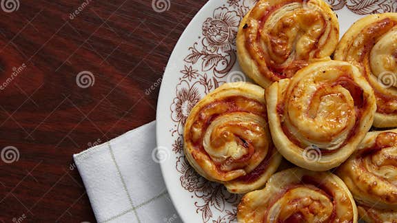Puff Pastry Snails, with Cheese and Ham on a Plate Stock Image - Image ...