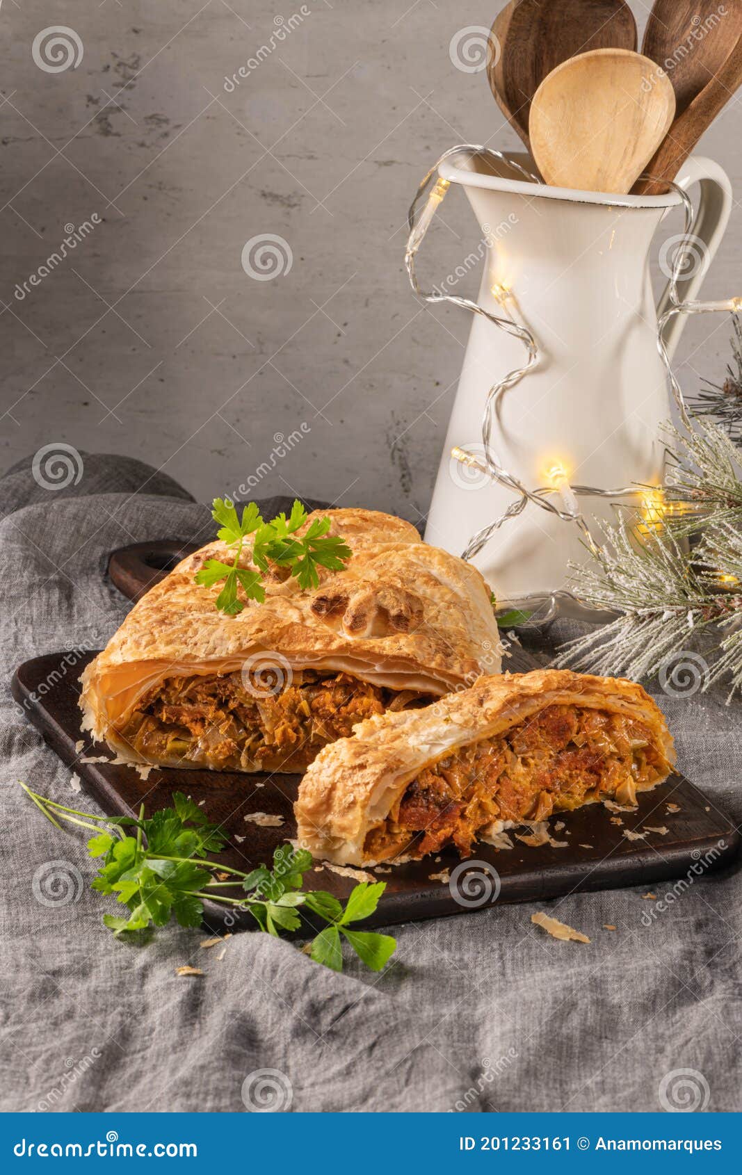 Puff Pastry Vegetable Roll on Kitchen Table with Christmas Decorated ...