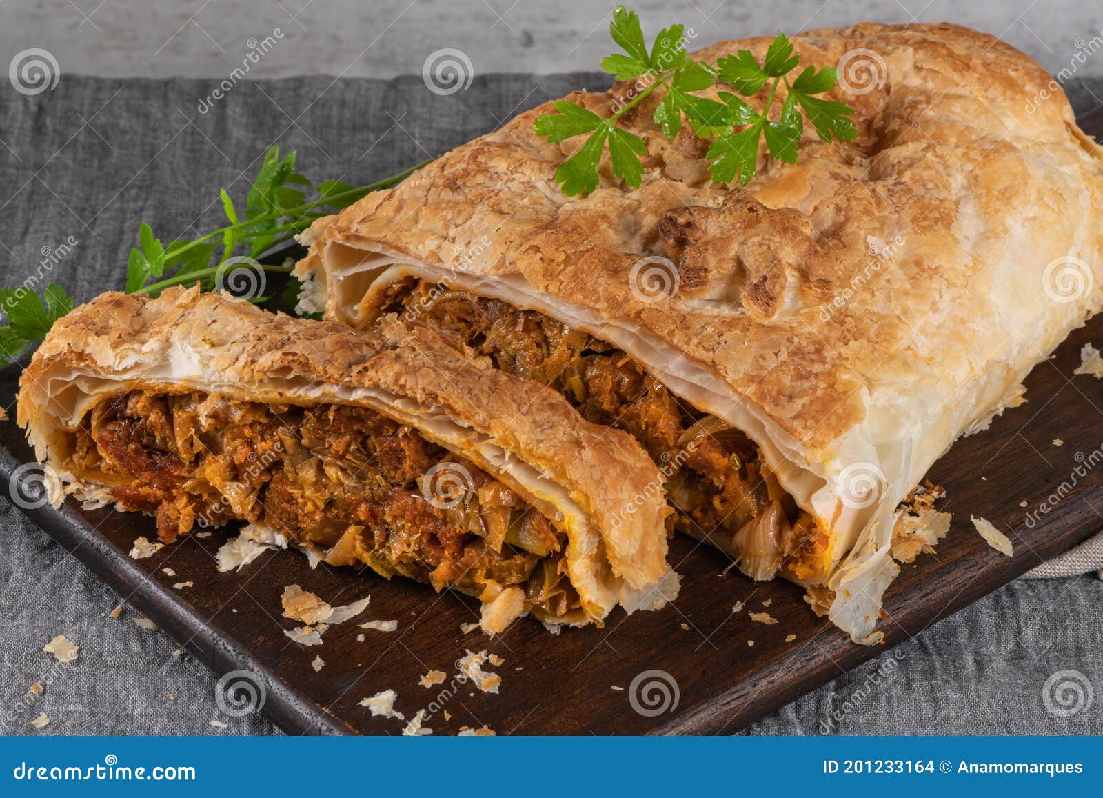 Puff Pastry Vegetable Roll on Kitchen Table with Christmas Decorated ...