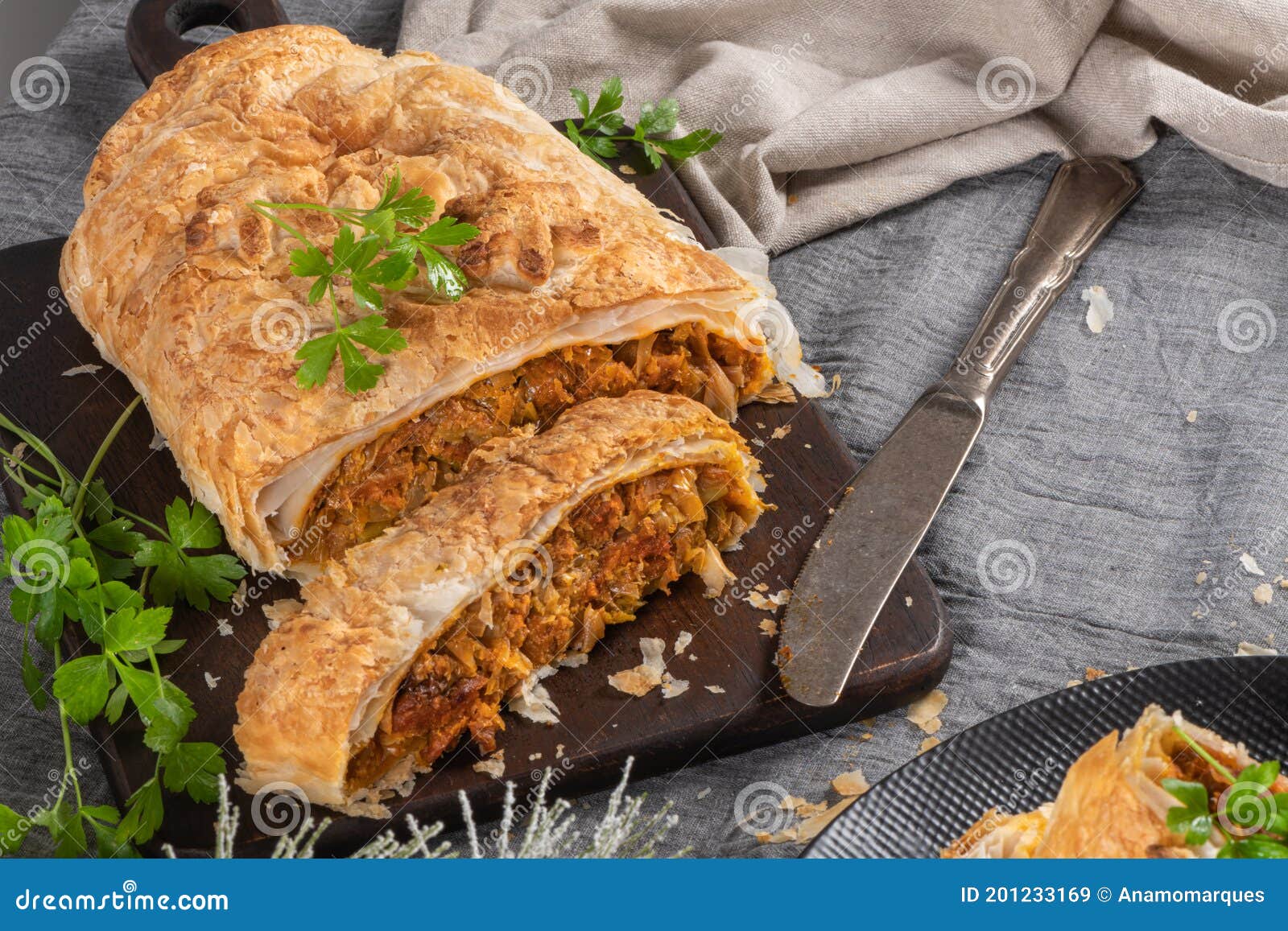 Puff Pastry Vegetable Roll on Kitchen Table with Christmas Decorated ...