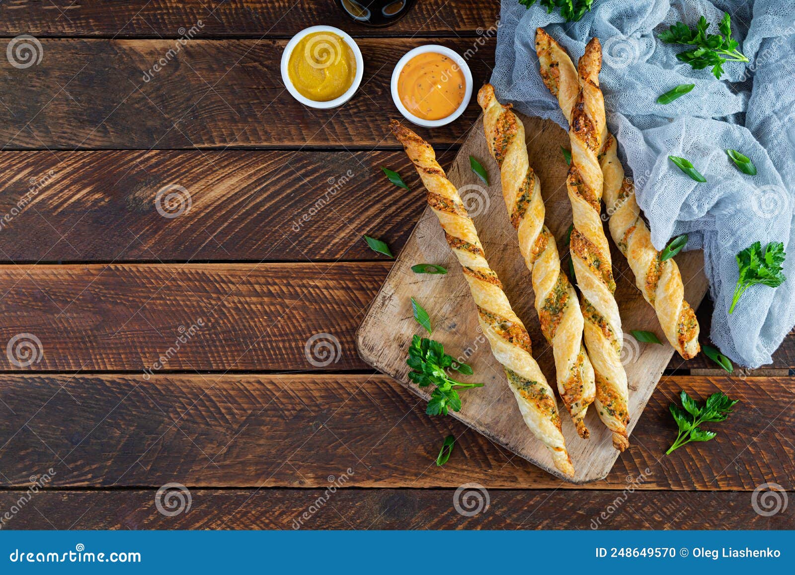 Puff Sticks with Cheese and Herbs. Homemade Breadsticks with Sauce ...