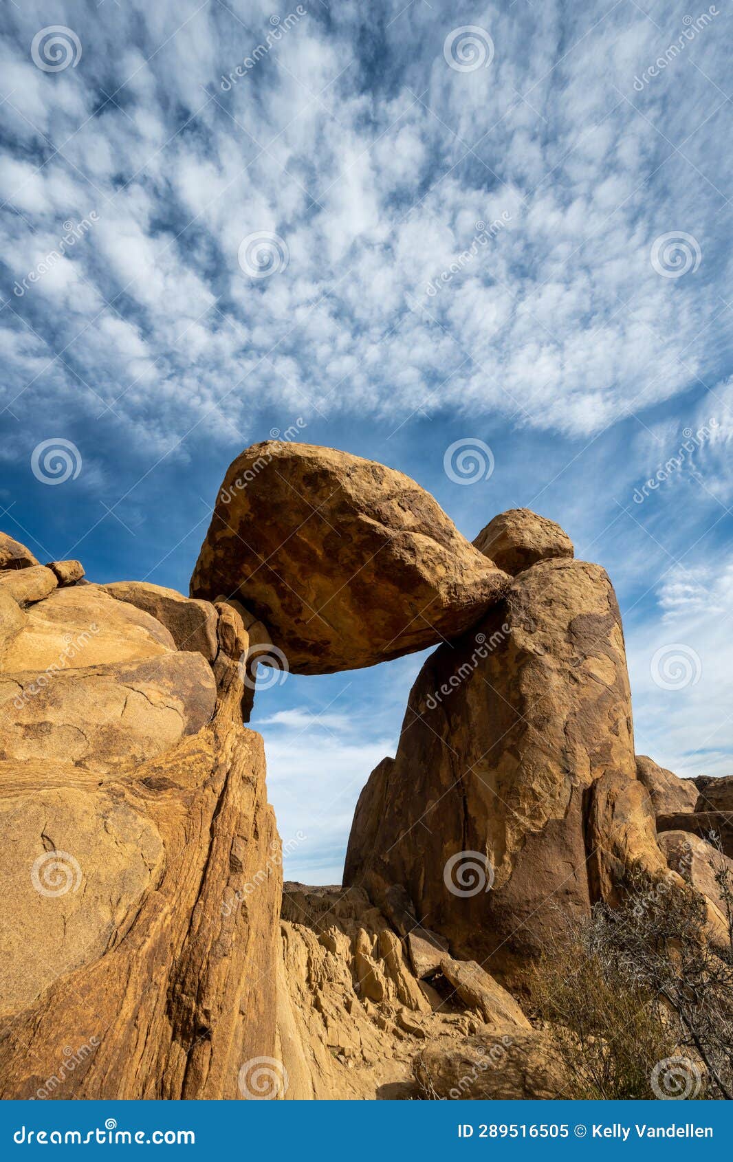 Puffy Cloud Wisps Over Balanced Rock Stock Image - Image of mountains ...