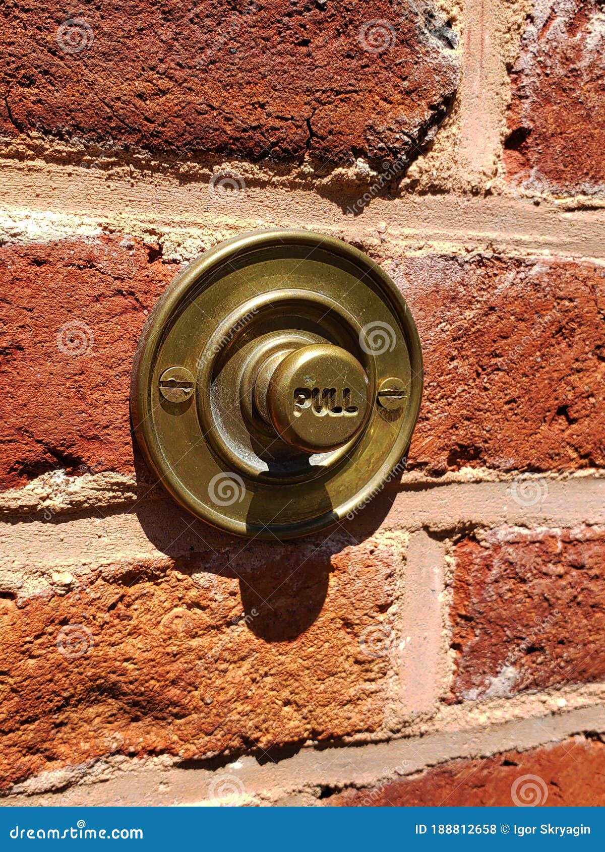 Pull button on brick wall stock photo. Image of bell - 188812658