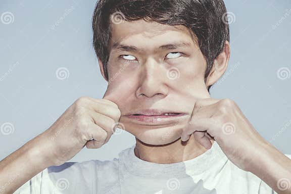 Pull the cheeks stock image. Image of eyes, hair, lips - 36030807