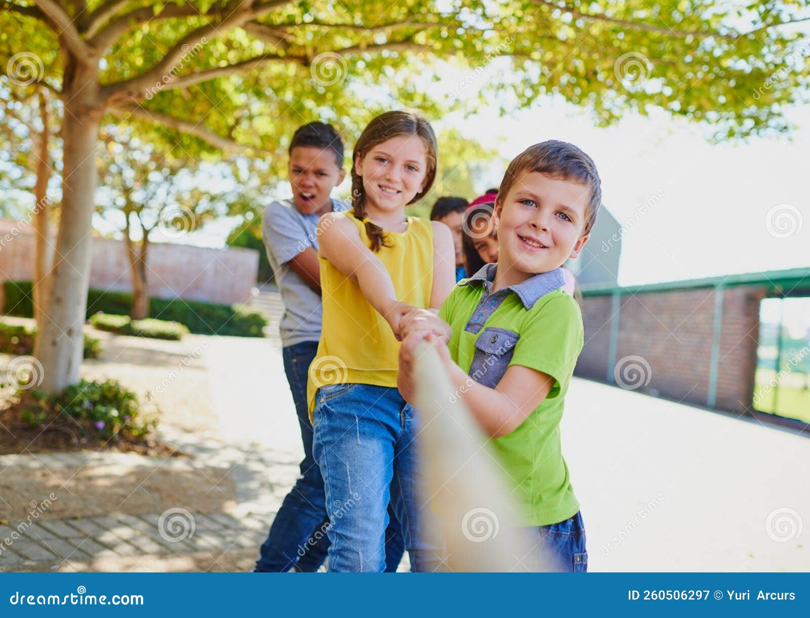 Pull Harder, we Can Do this. a Diverse Group of Children Playing Tug of ...