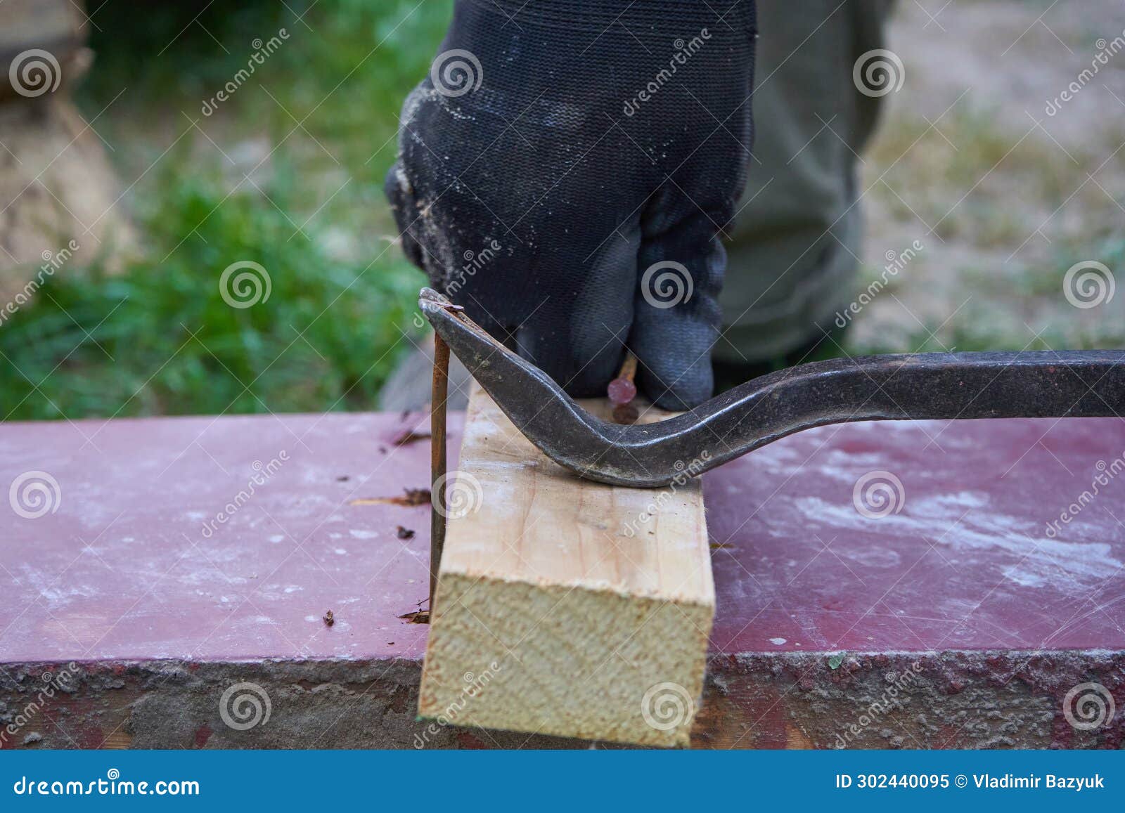 Pull Out Crowbar Nails, a Nail Puller Pulls a Nail Out of the Board ...