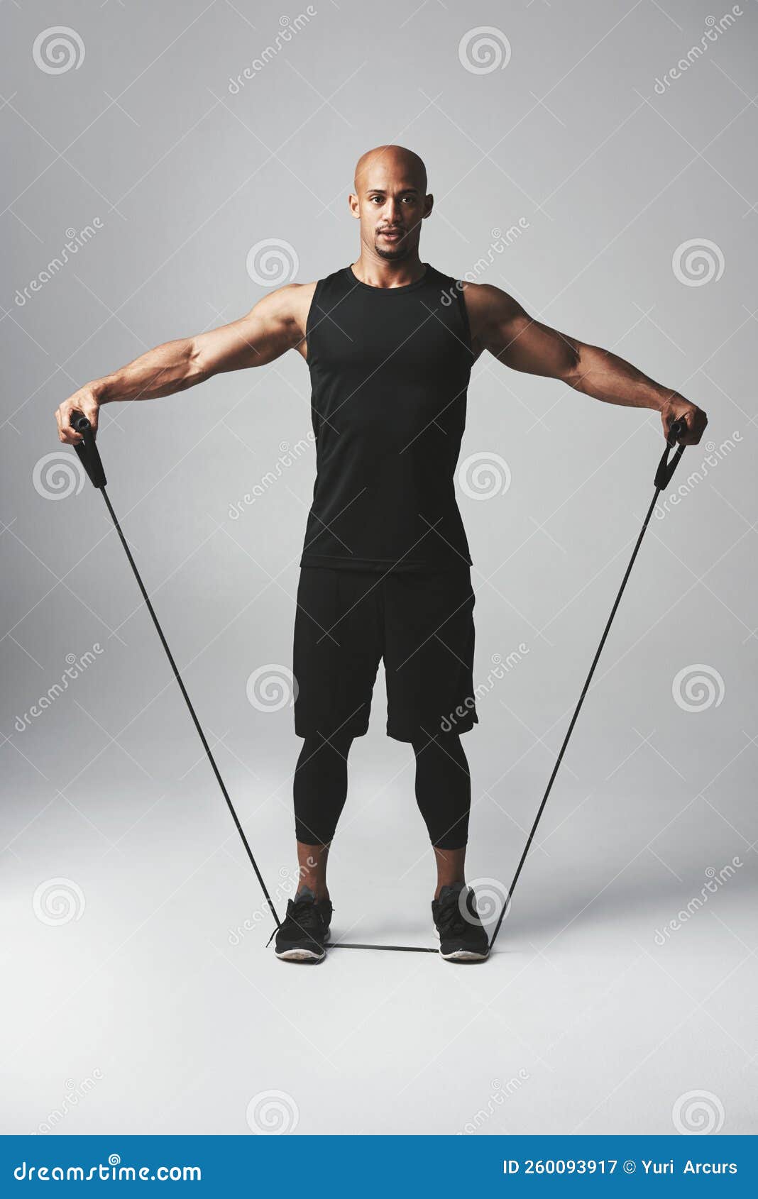 Pulling His Weight. Studio Portrait of an Athletic Young Man Working ...