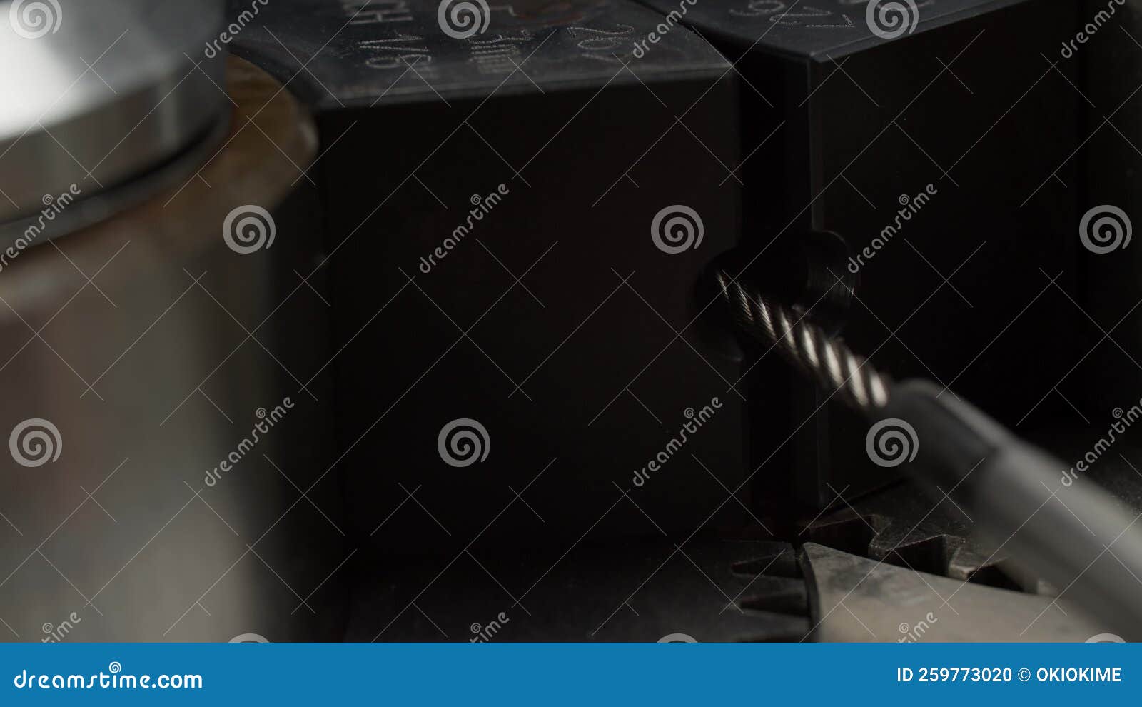 Pulling Metal Wire Rope through Machine Tool with Cog Wheels Stock ...