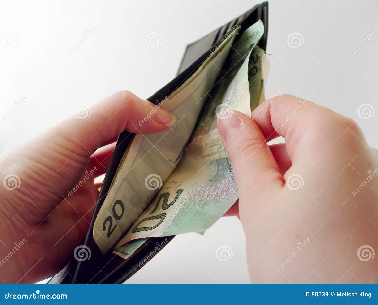 Pulling Money Out of Wallet Stock Image - Image of bills, green: 80539