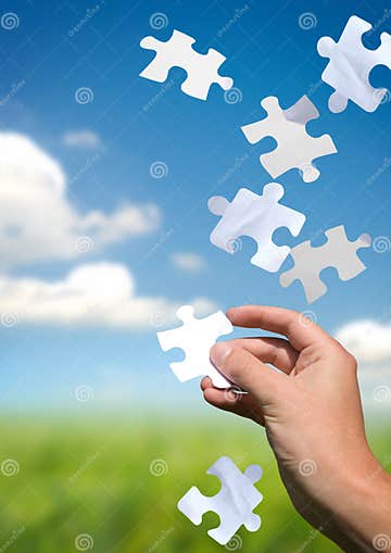 Pulling Puzzle Pieces stock photo. Image of backdrop, puzzle - 5855176