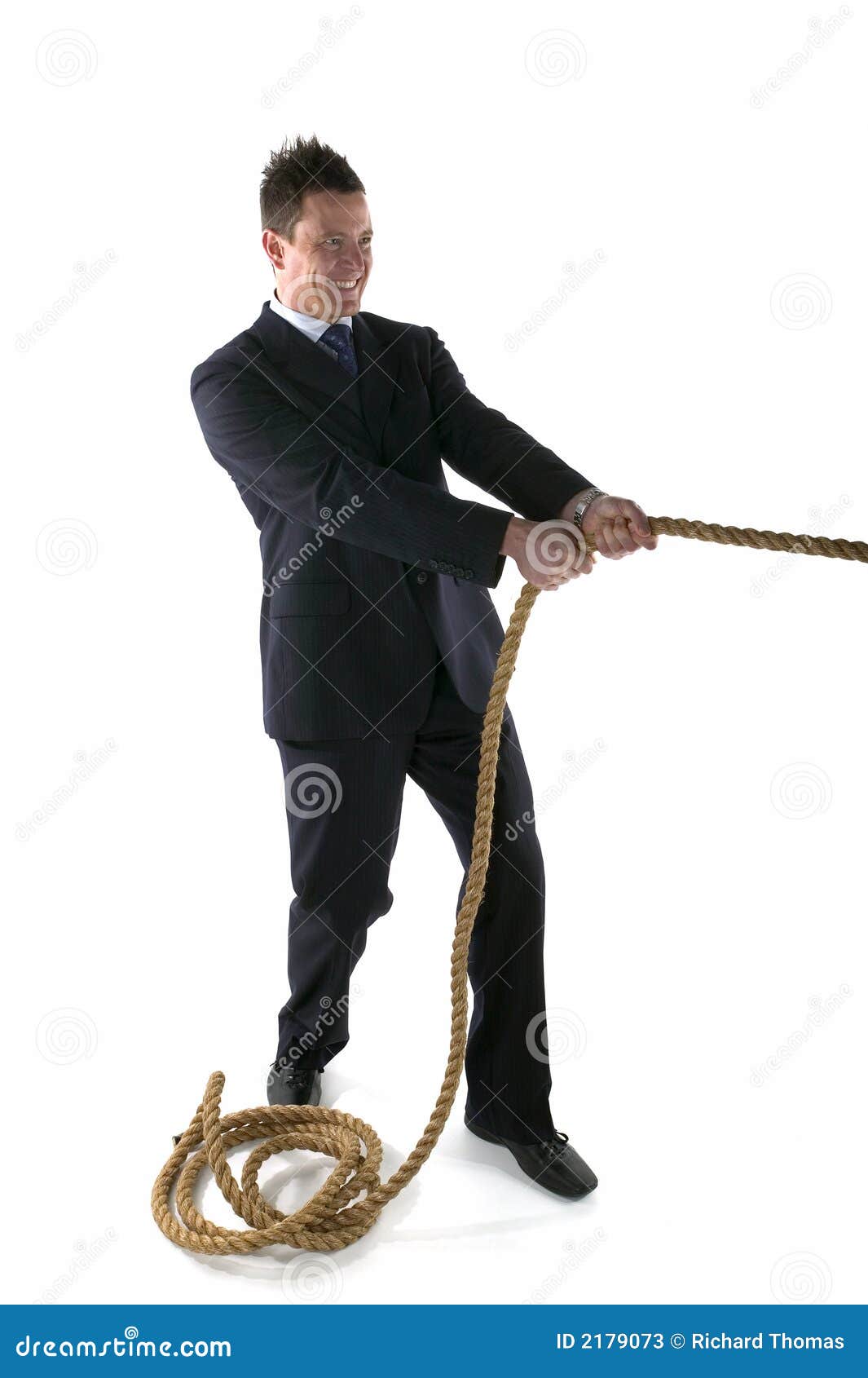 Pulling on a rope stock image. Image of handsome, successful - 2179073