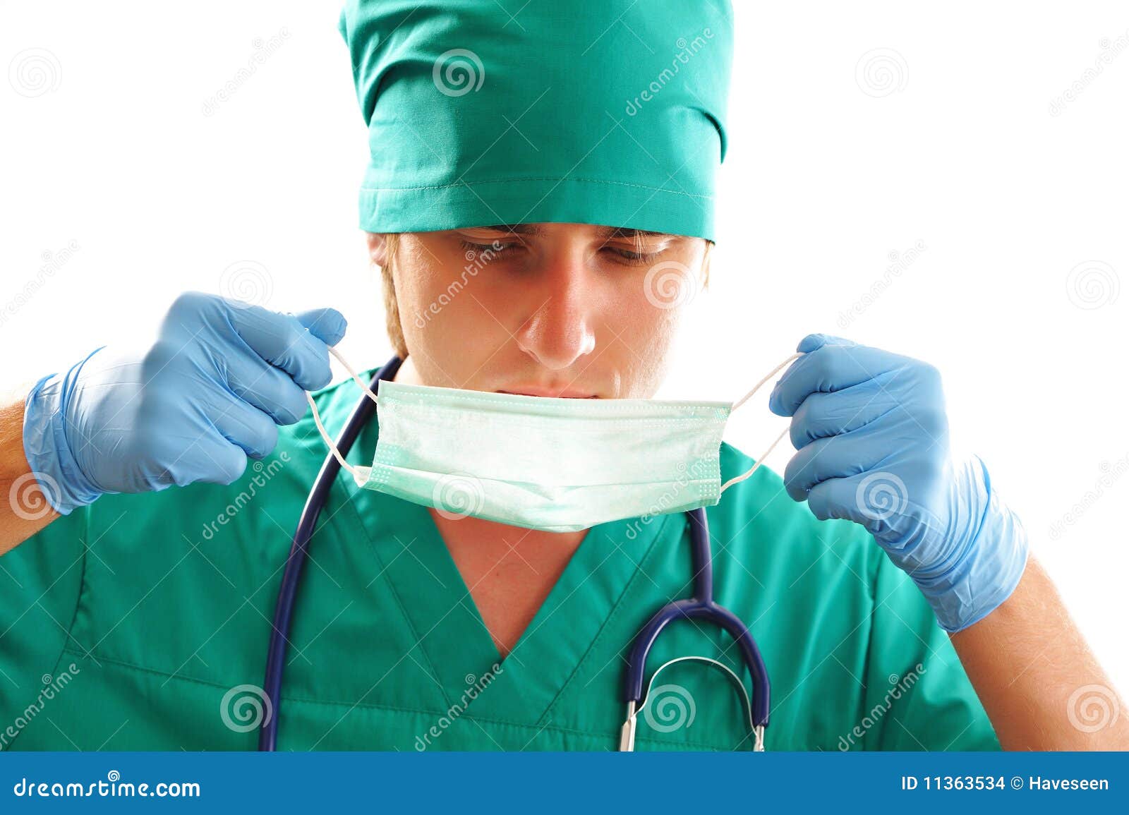 Pulling on surgical mask stock photo. Image of medicine - 11363534