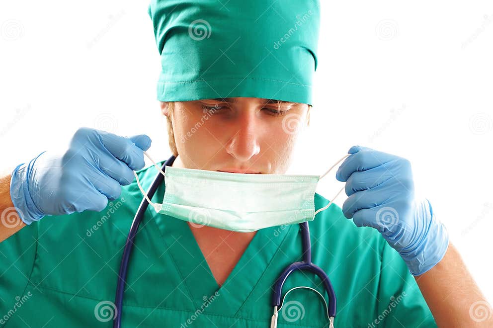 Pulling on surgical mask stock photo. Image of medicine - 11363534