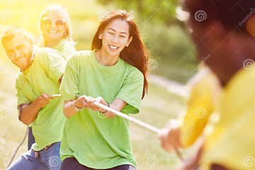 Pulling Together in a Tug-of-war Stock Photo - Image of building ...