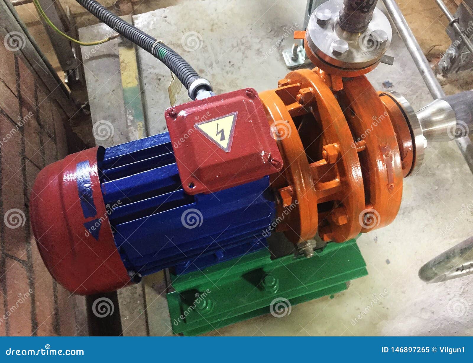 Pump and Engine at an Industrial Facility. Caution the Equipment in ...