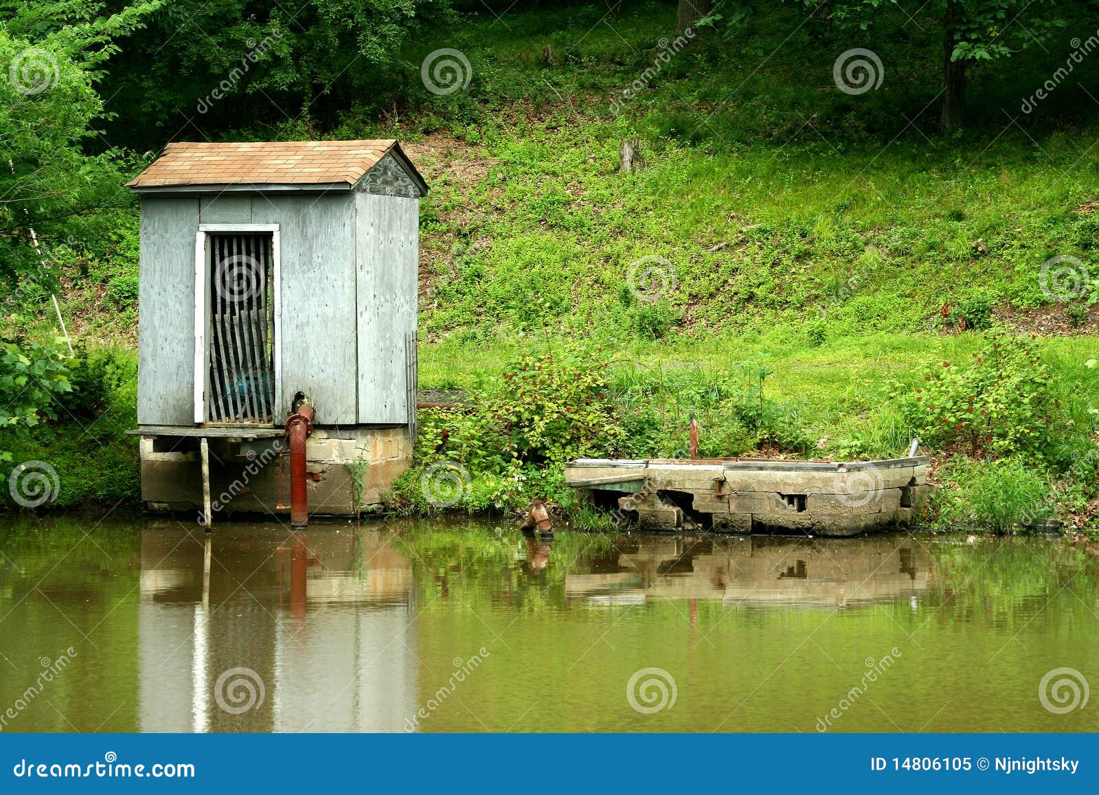 Pump house on a small pond stock image. Image of green - 14806105
