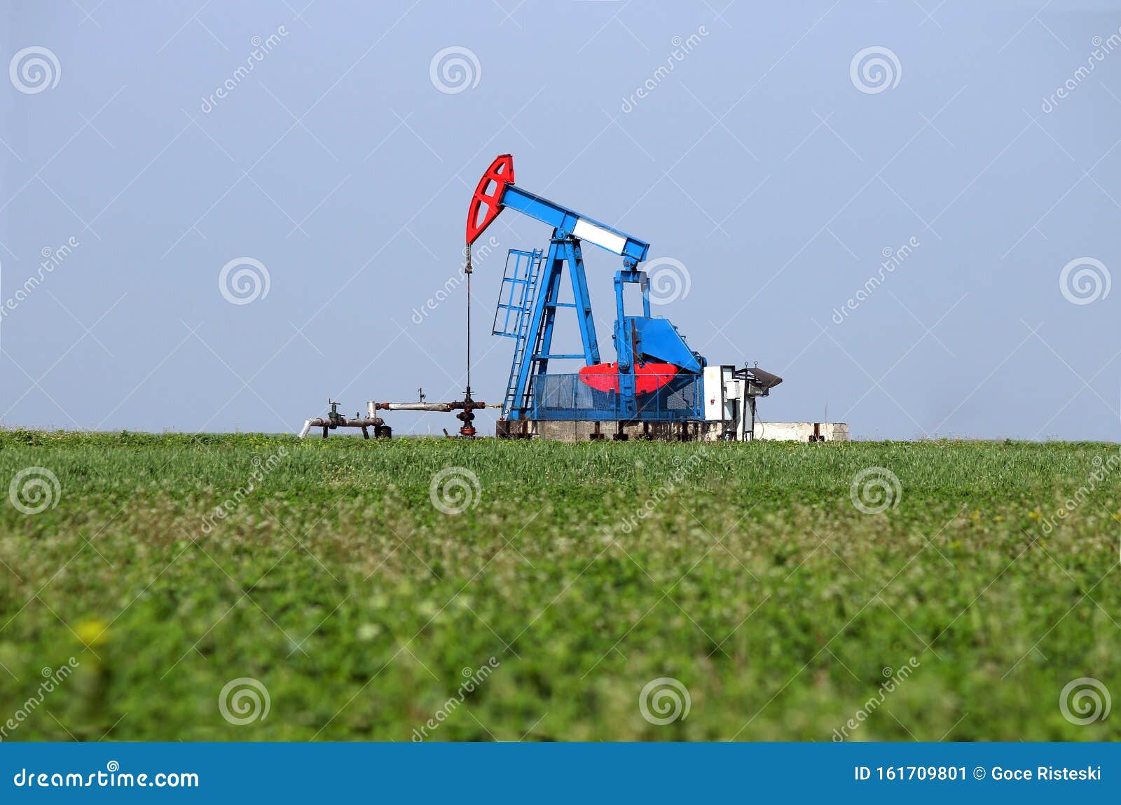 Pump jack on field oil stock image. Image of extraction - 161709801