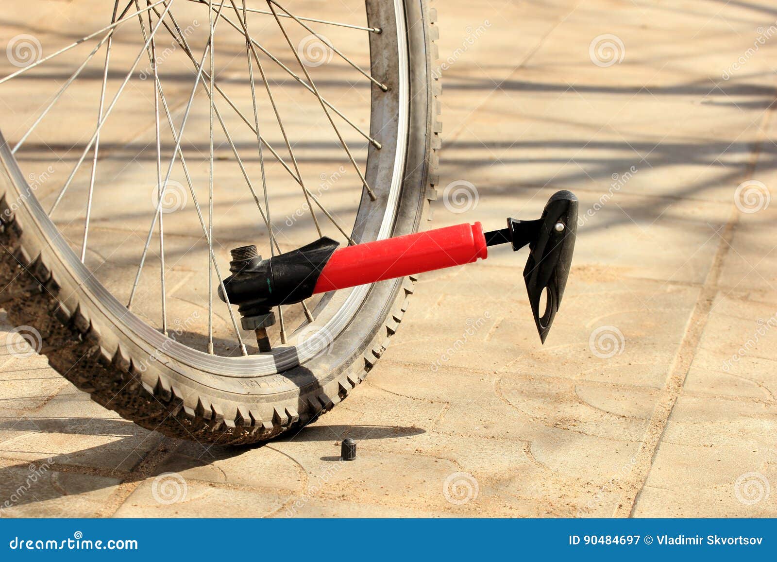 Pumping Bicycle Wheel Red Bicycle Pump. Stock Image - Image of ...
