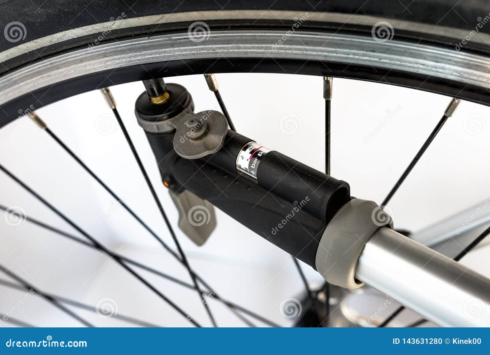Pumping the Bicycle Wheel Using a Hand Pump with Air Pressure Indicator ...
