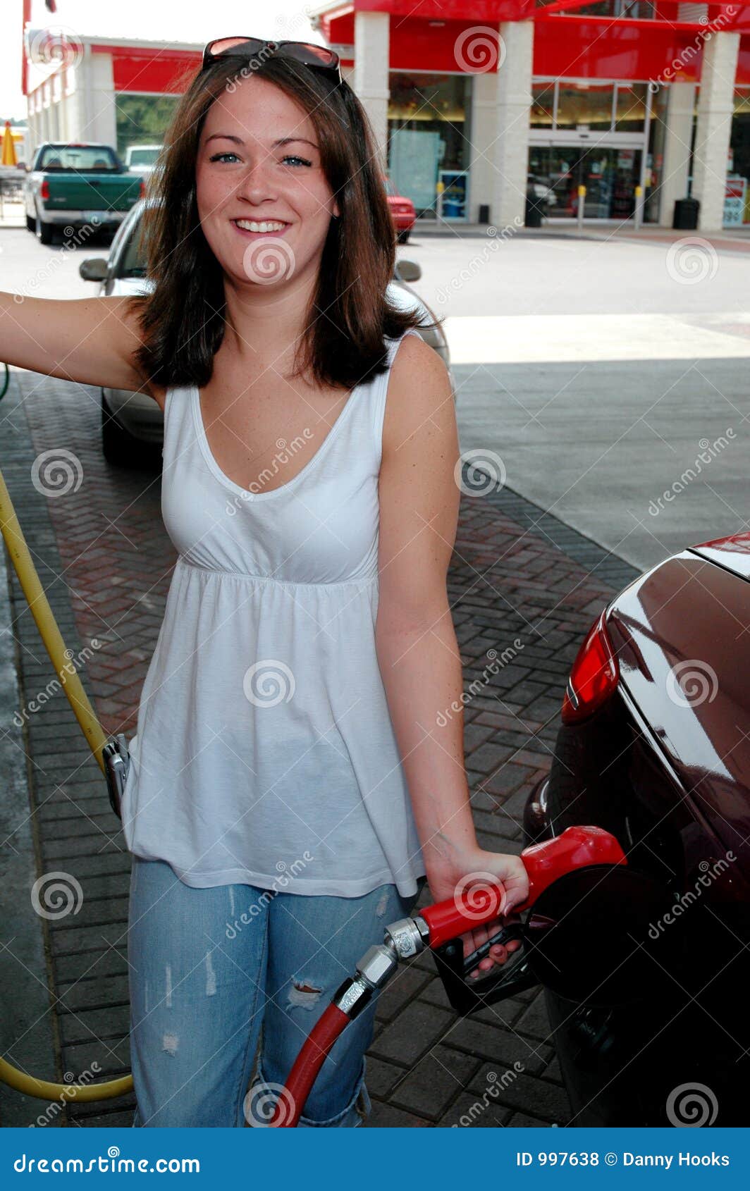 Pumping Gas - Happy stock photo. Image of attractive, striking - 997638