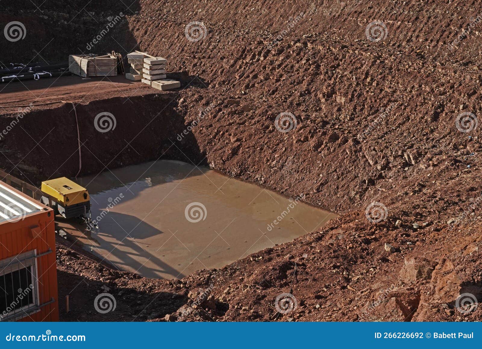 Pumping Out Water in the Excavation Pit Stock Photo - Image of pumping ...