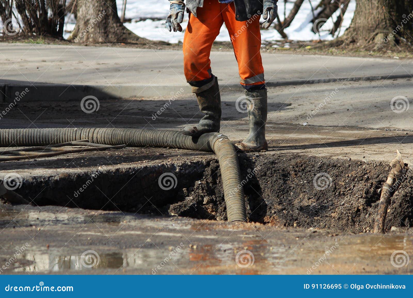 Two Pipes With Cold Water Flowing From The Floor And A Valve From The ...