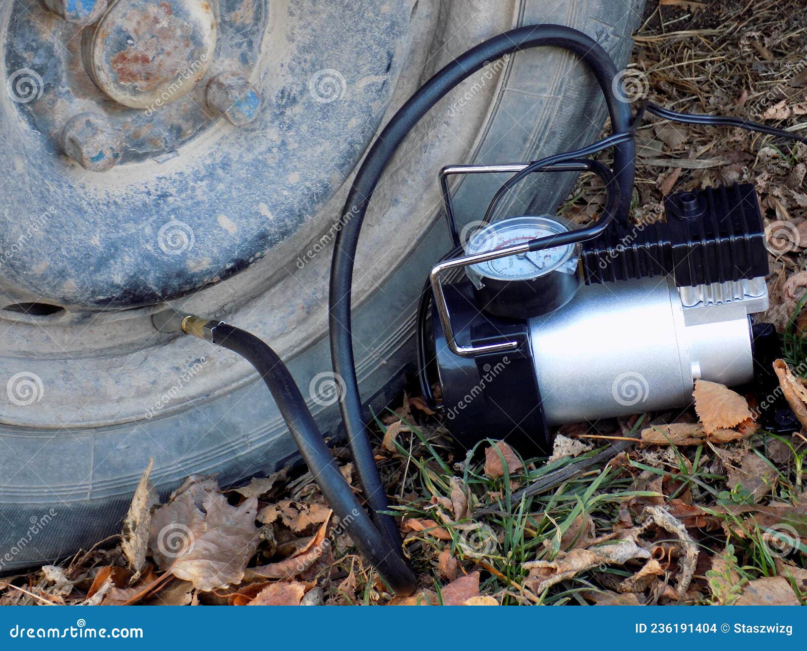 Pumping a Wheel in a Road with a Compressor Stock Photo - Image of ...