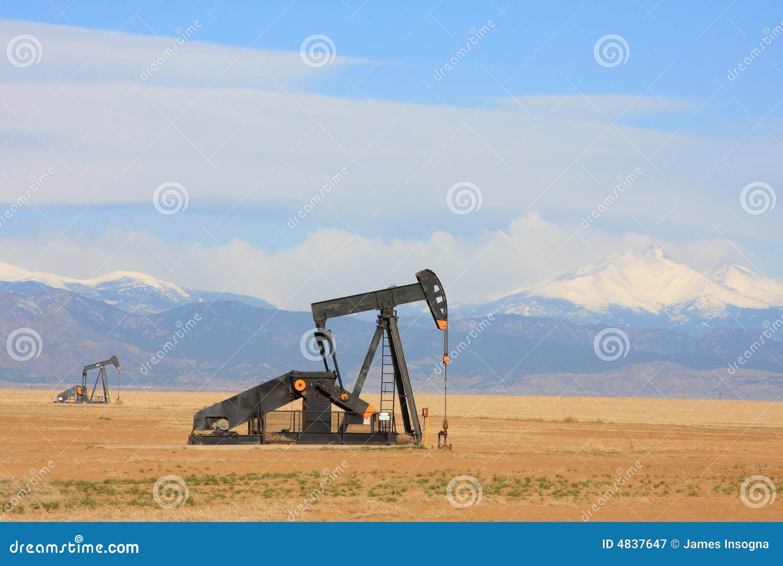 Pumpjack Pumping Oil, Snow Capped Mountains Stock Image - Image of pump ...