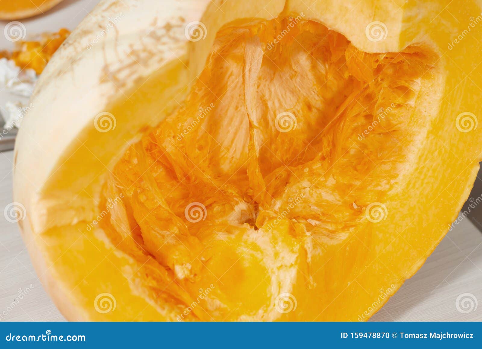 The Pumpkin Cut in Half with the Pulp Selected from the Inside Lies on ...