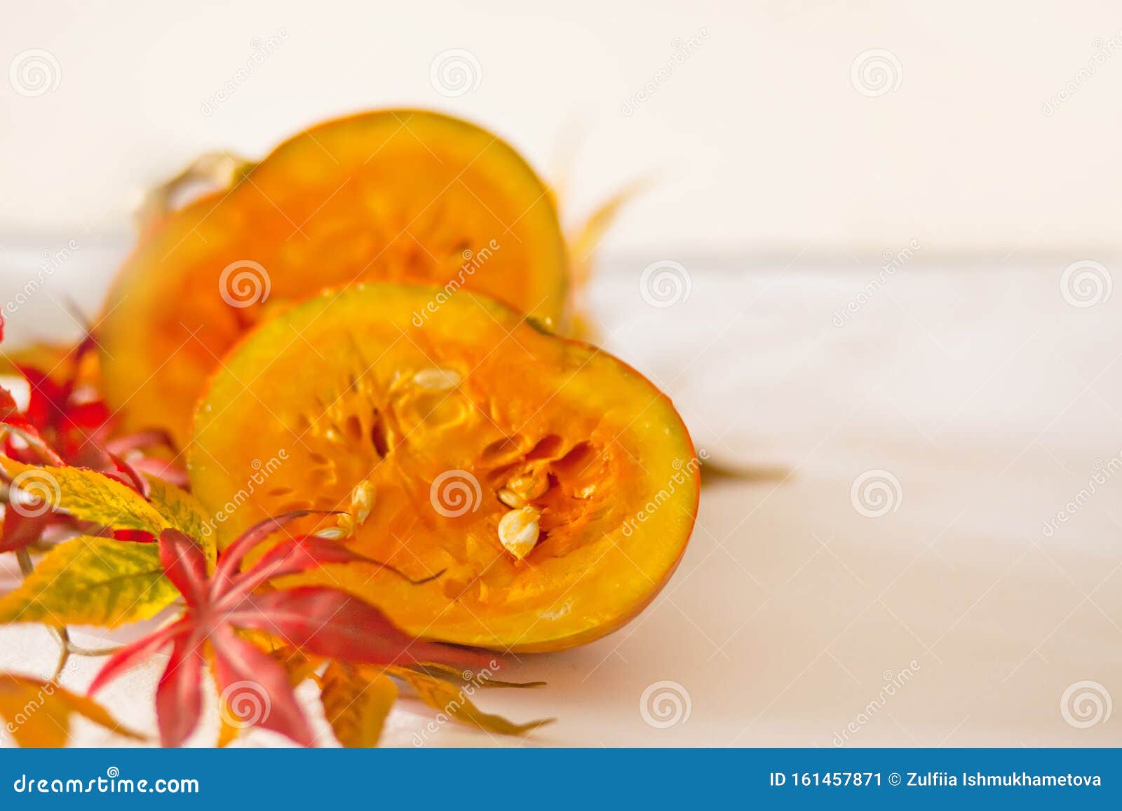 Pumpkin Cut Open with Seeds with Autumn Leaves Stock Image - Image of ...